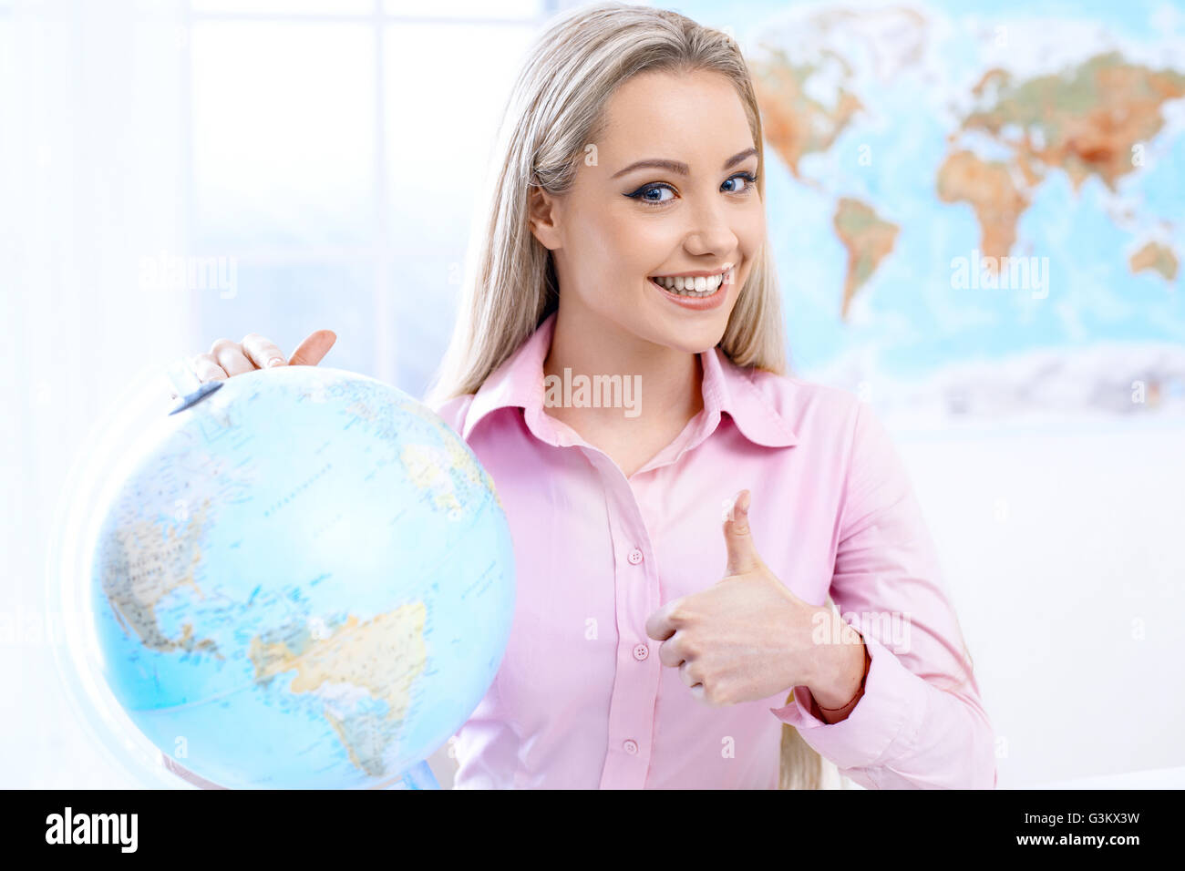 Female travel agent at office Stock Photo - Alamy