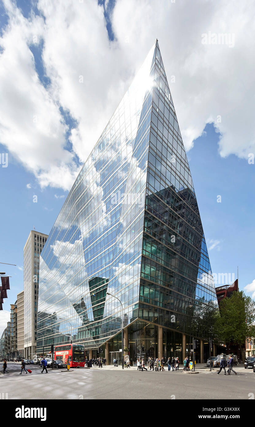 View across intersection towards building entrance with street scene ...