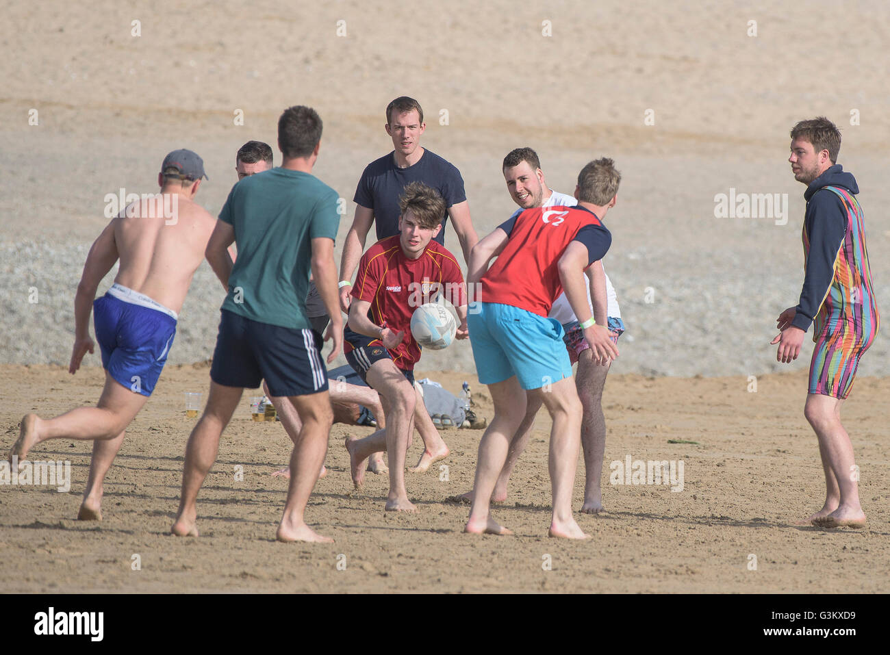 Playing beach rugby hi-res stock photography and images - Alamy