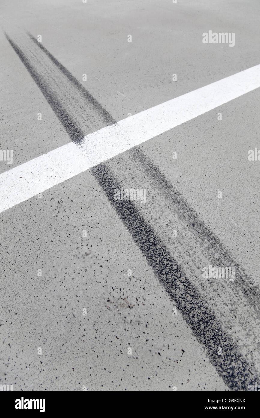 Tire tracks, skid marks on a parking lot Stock Photo - Alamy