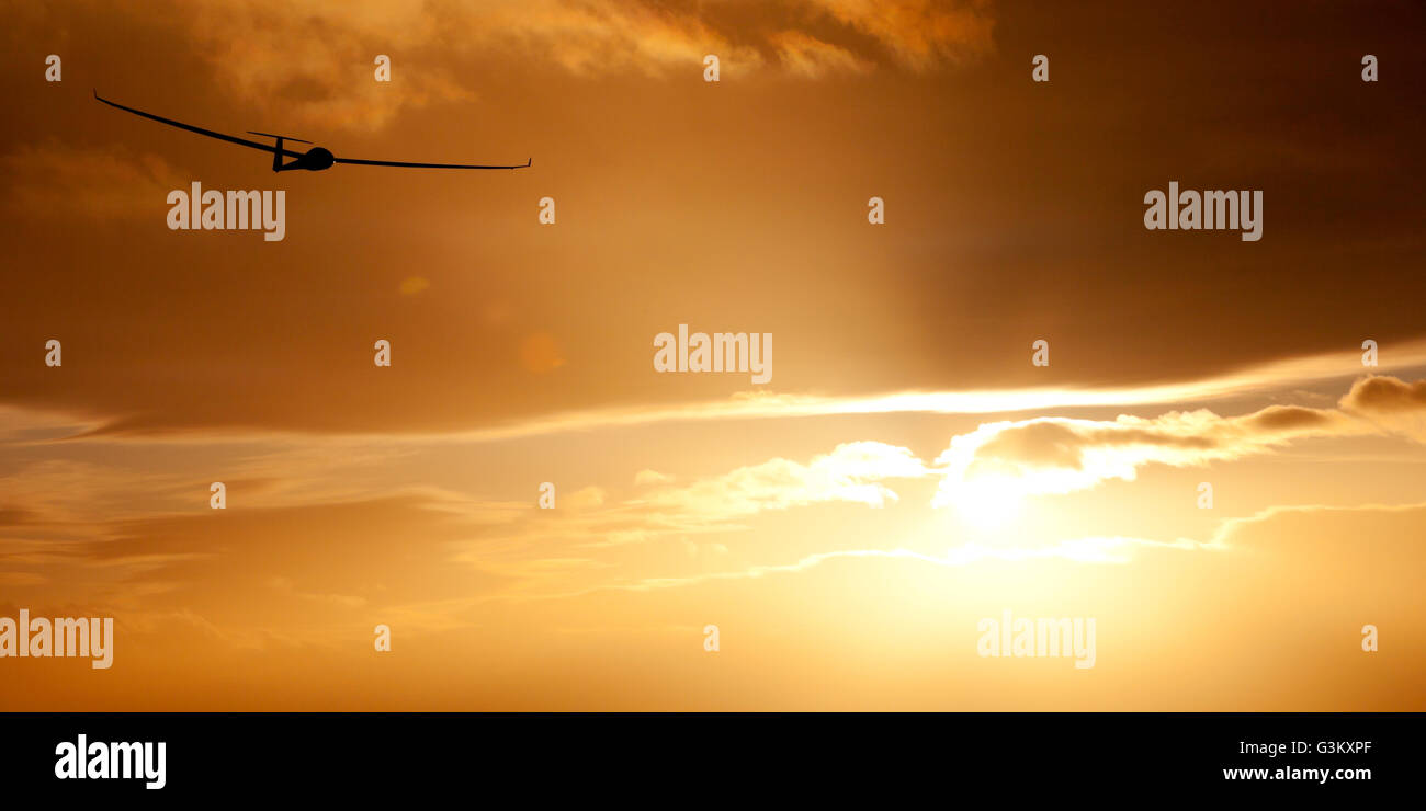 Glider at sunset Stock Photo - Alamy