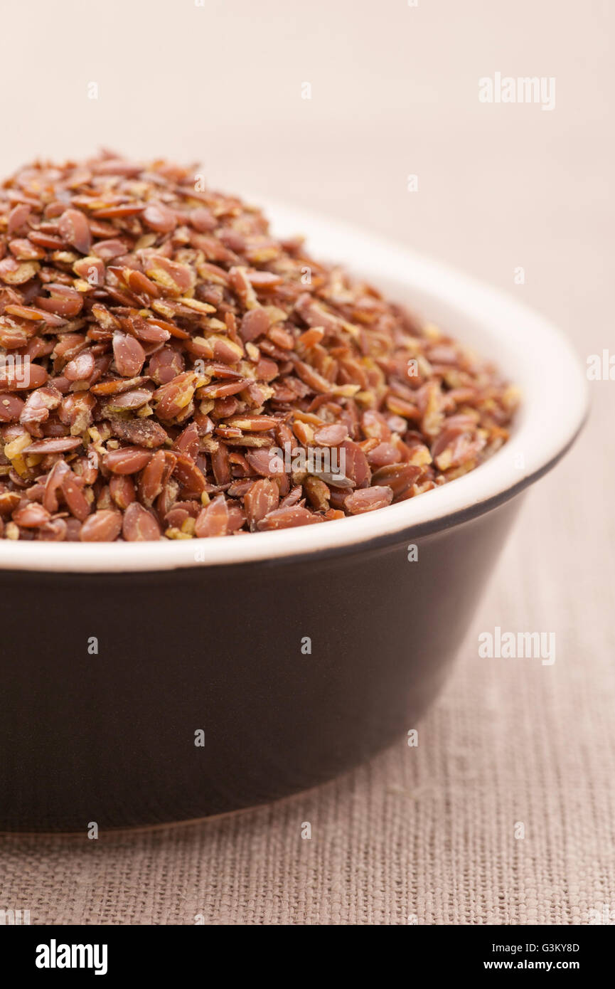 Crushed brown flax seeds in a bowl Stock Photo - Alamy