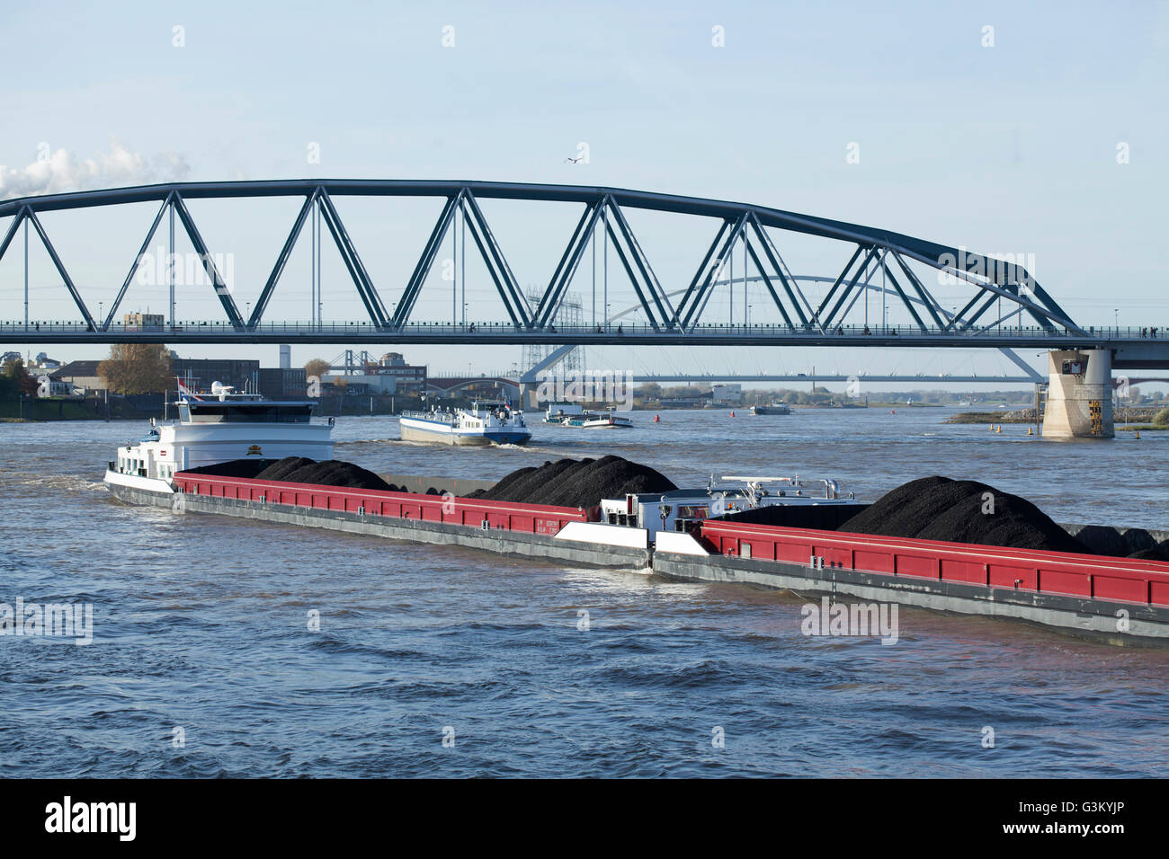 Barge with a cargo of coal, Waal river with railroad bridge Spoorbrug ...