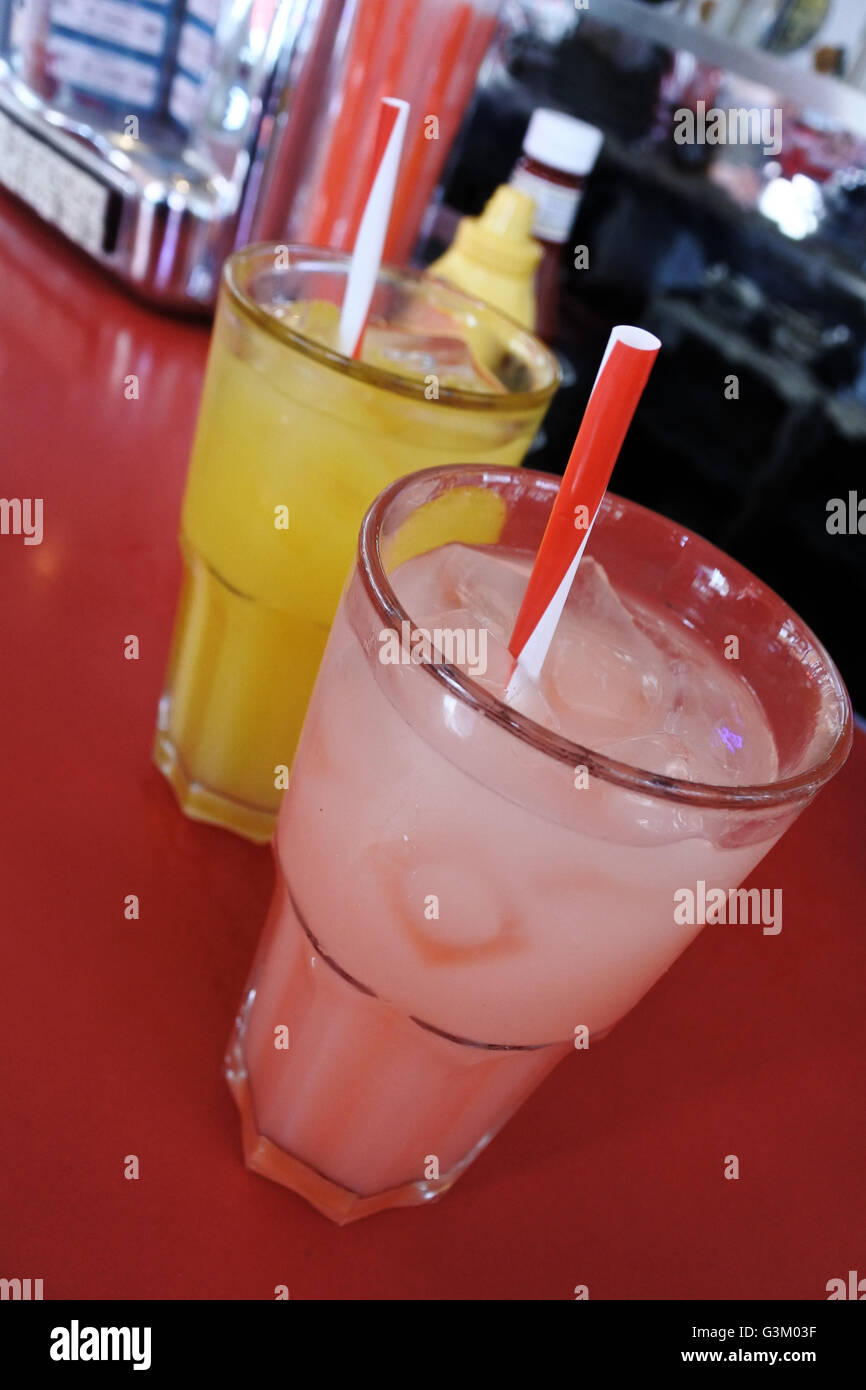 cold soda summer cooler pink lemonade mango fruit Stock Photo - Alamy