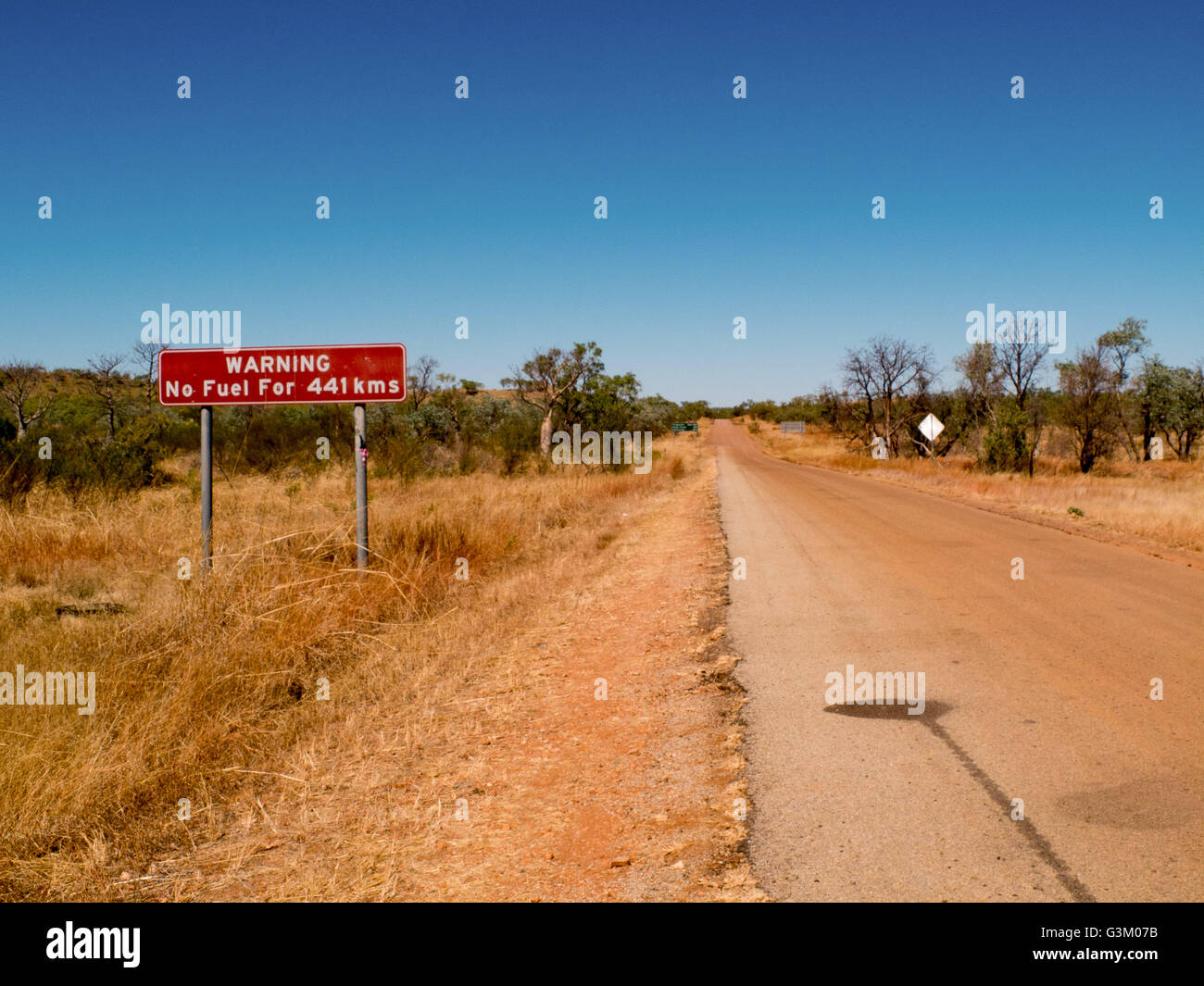 A sign warns of no more petrol stations in the Australian outback on ...