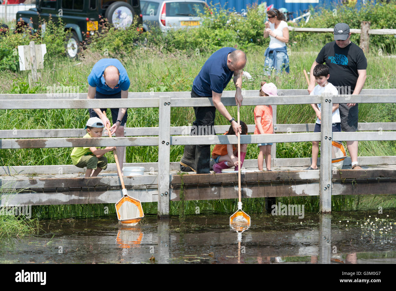 Children by a pond hi-res stock photography and images - Alamy