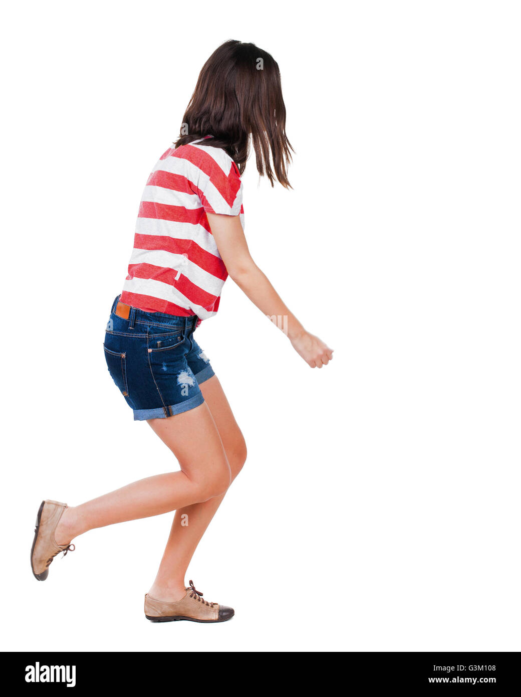 back view of running woman. beautiful brunette girl in motion. backside ...