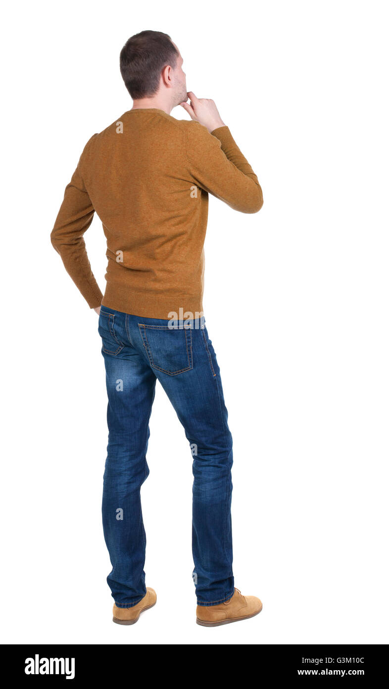 Back view of handsome man in blue pullover. Standing young guy in ...