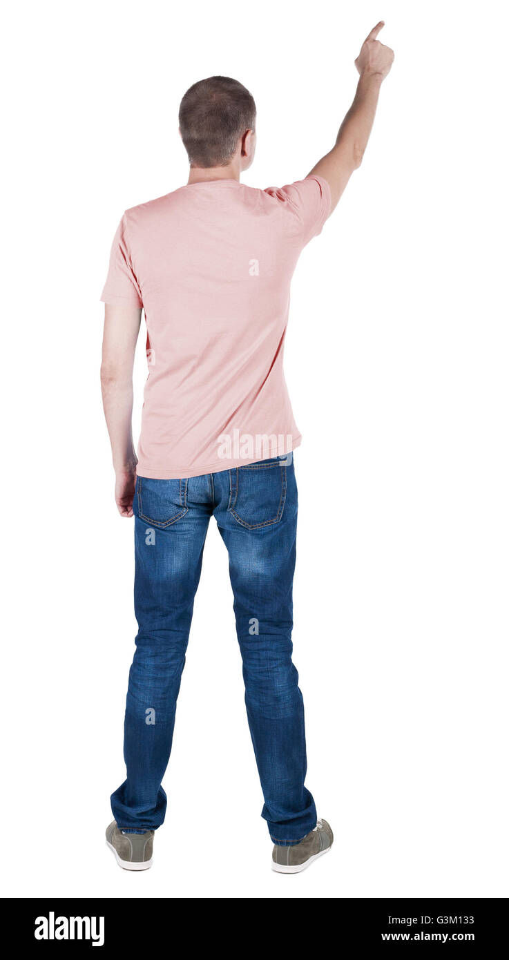 Back view of pointing young men in shirt and jeans. Young guy gesture ...