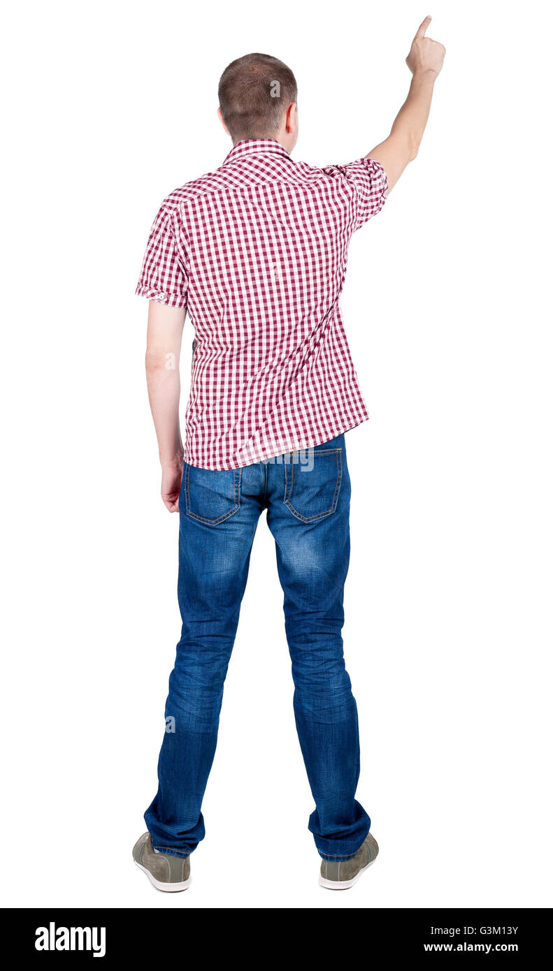 Back view of pointing young men in shirt and jeans. Young guy gesture ...