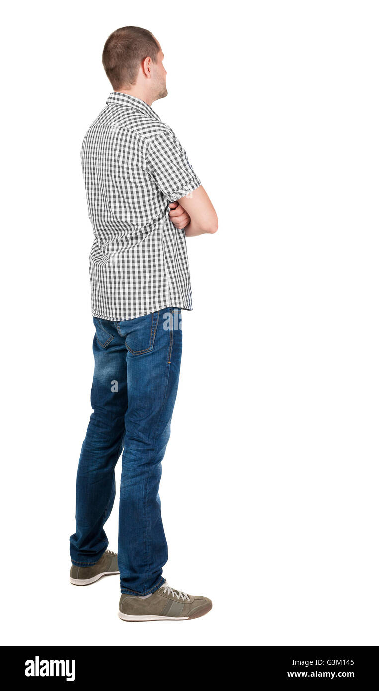 Back view of handsome man in shirt looking up. Standing young guy in ...