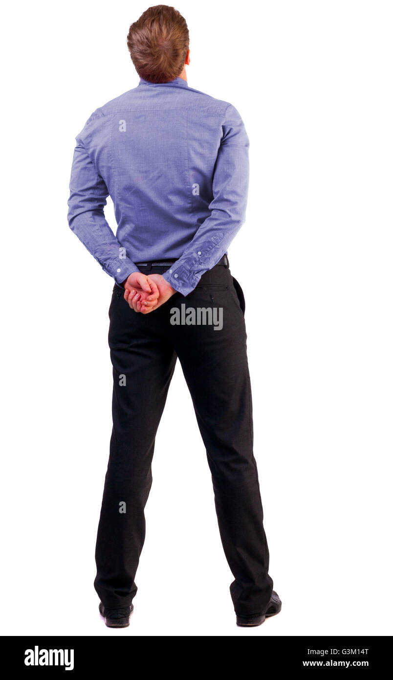 back view of Business man looks ahead. Young guy in pink shirt watching ...