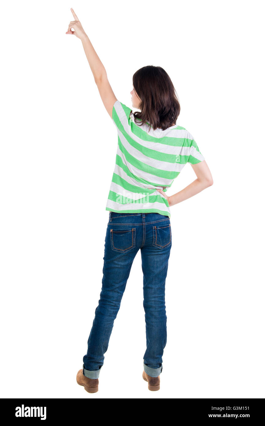 Back view of pointing woman. beautiful brunette girl in yellow striped ...