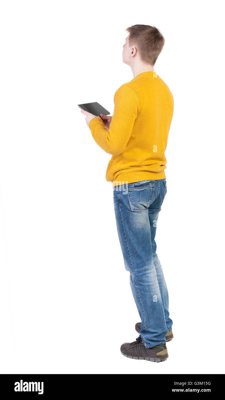 Back view of man with tablet. Standing young guy. Rear view people ...