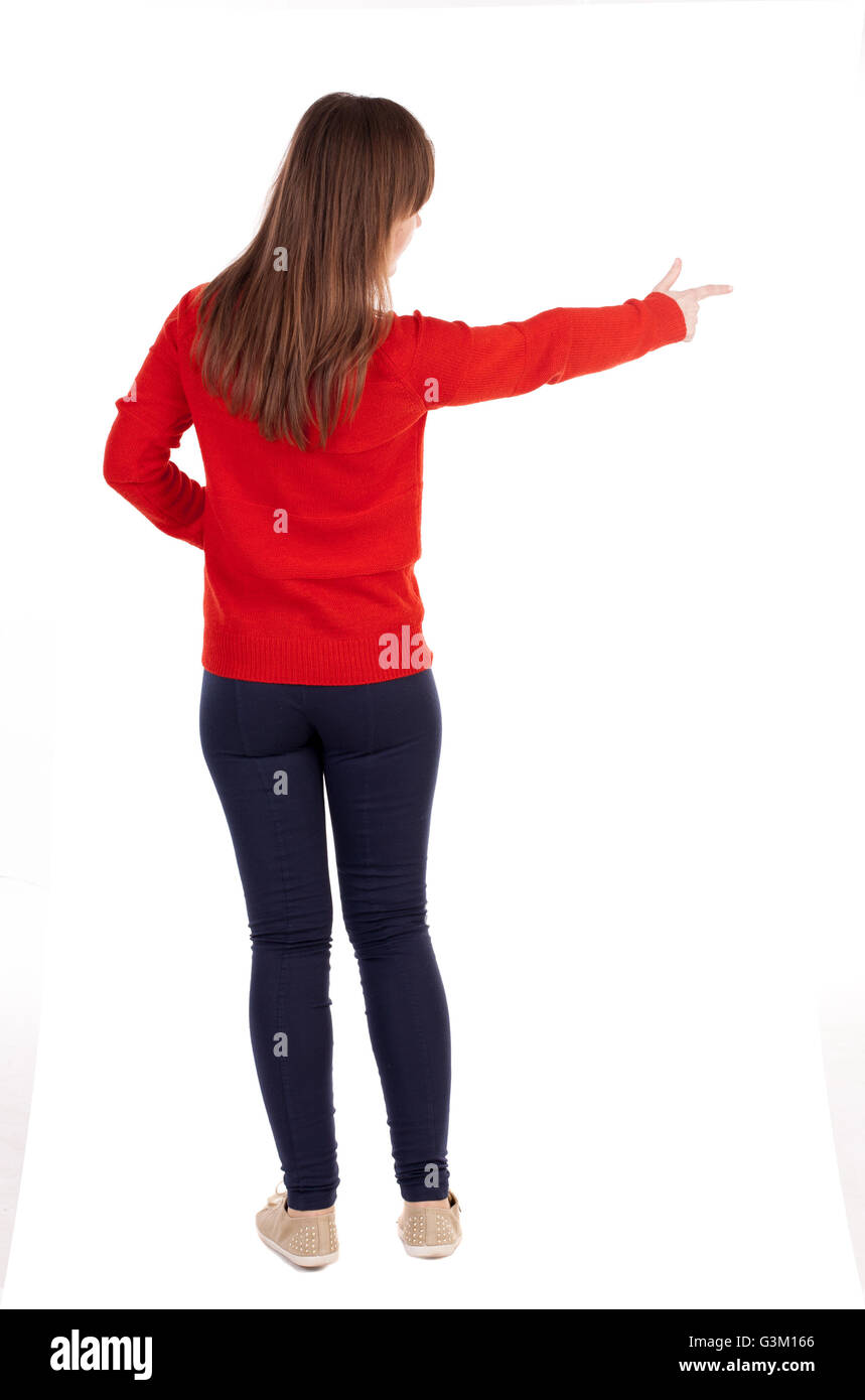 Back view of pointing woman. beautiful girl. Rear view people ...