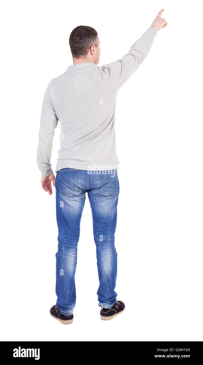 Back view of pointing young men in shirt and jeans. Young guy gesture ...