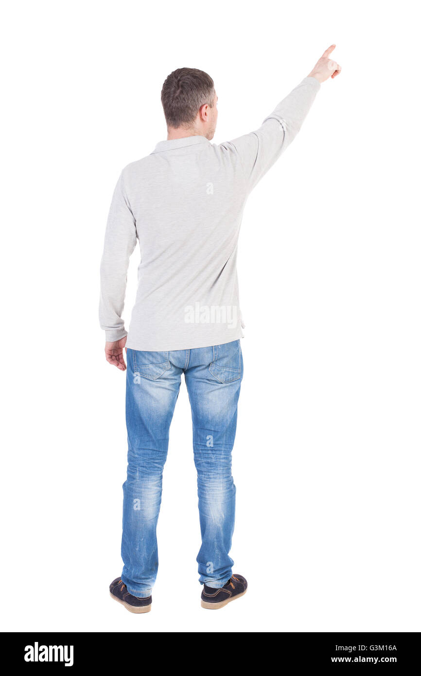 Back view of pointing young men in shirt and jeans. Young guy gesture ...