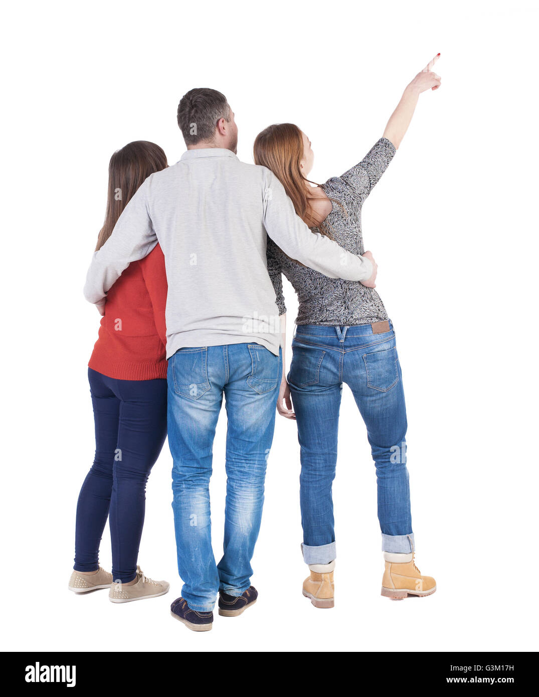 Back view of three friends pointing. group of people watching somewhere ...