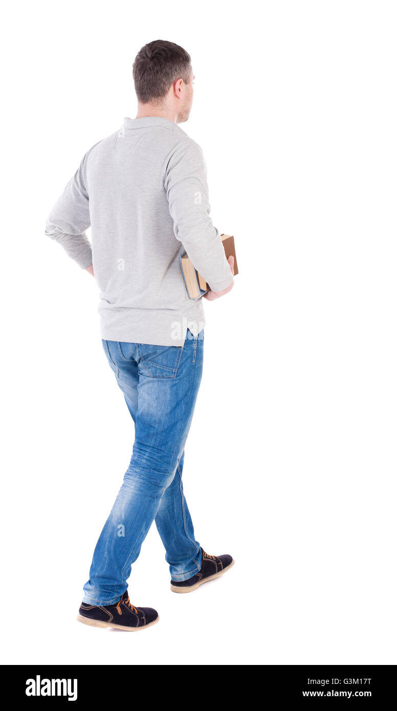 man goes and has a stack of books. back view. Rear view people ...