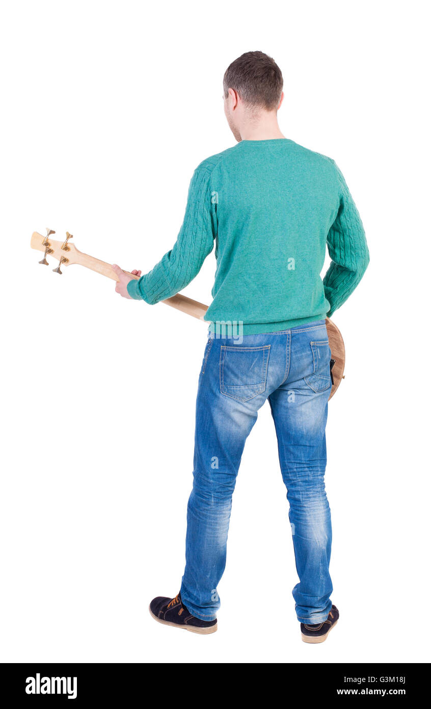 Back view of a young man with a guitar. Rock star with a musical ...