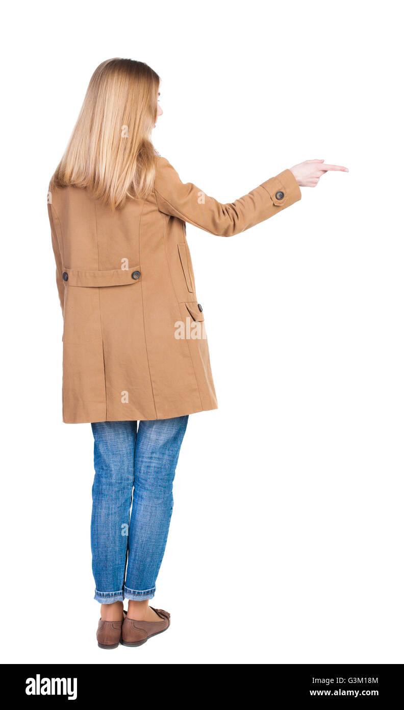 Back view of pointing woman. beautiful girl. Rear view people ...