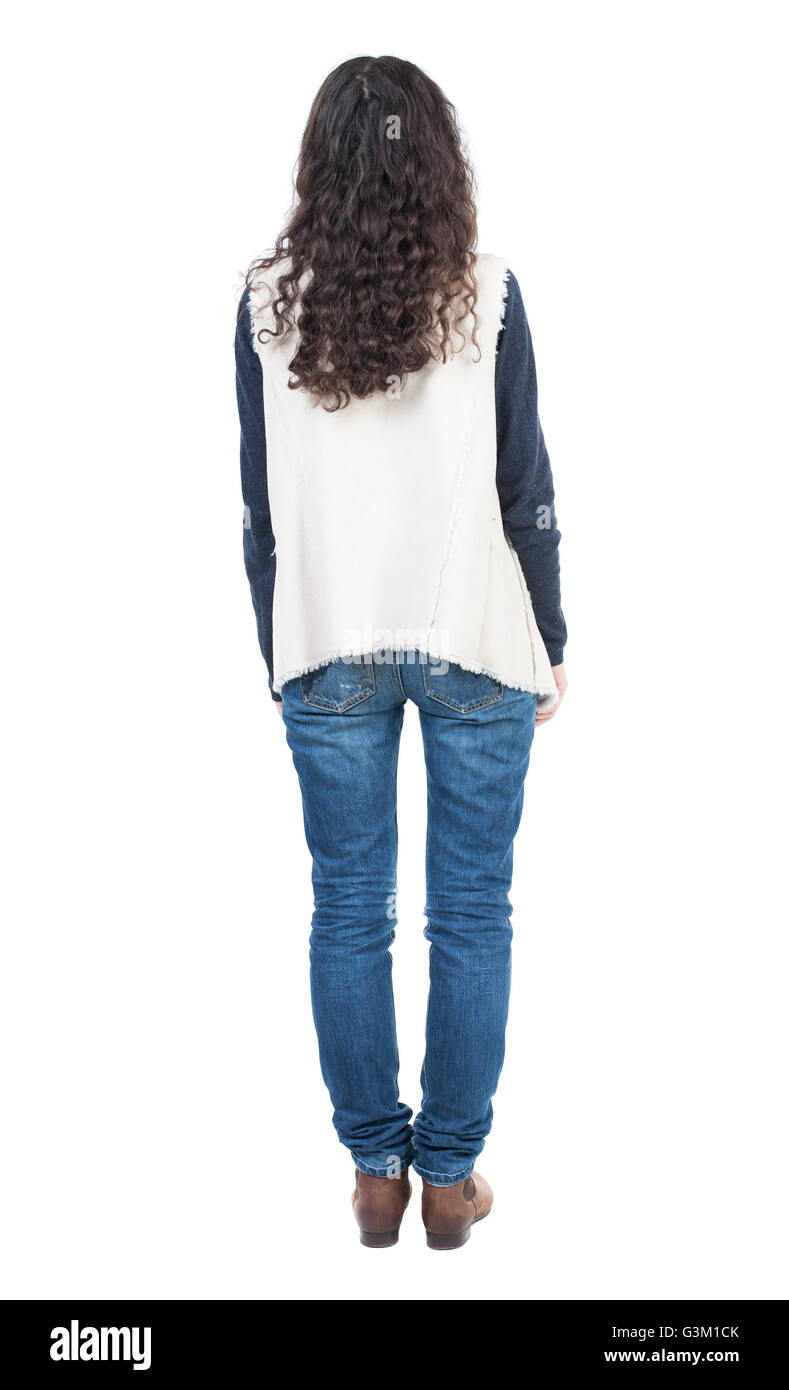 back view of standing young beautiful woman. girl watching. Rear view ...