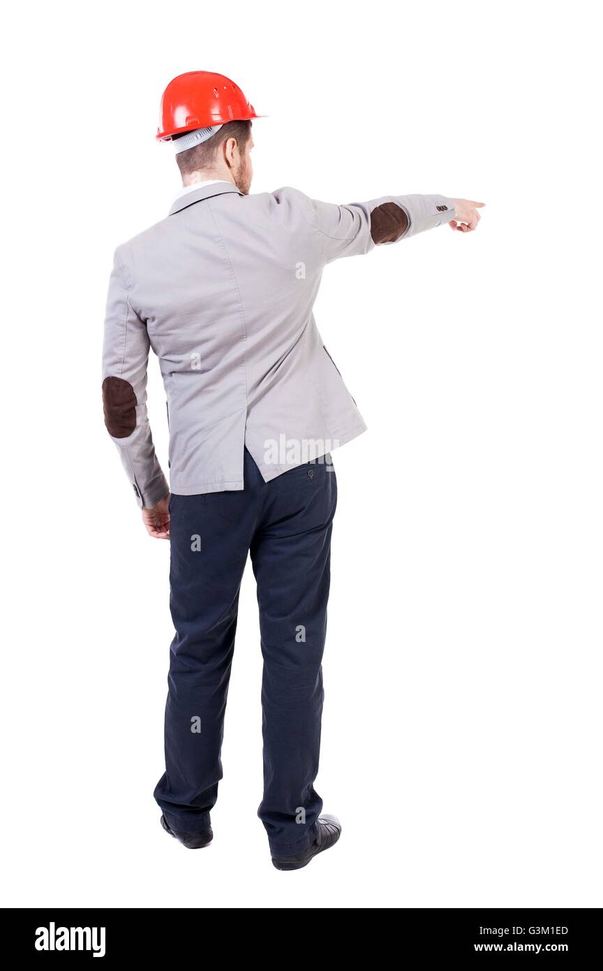 Back view of pointing young men in helmet. Young guy gesture. Rear view ...
