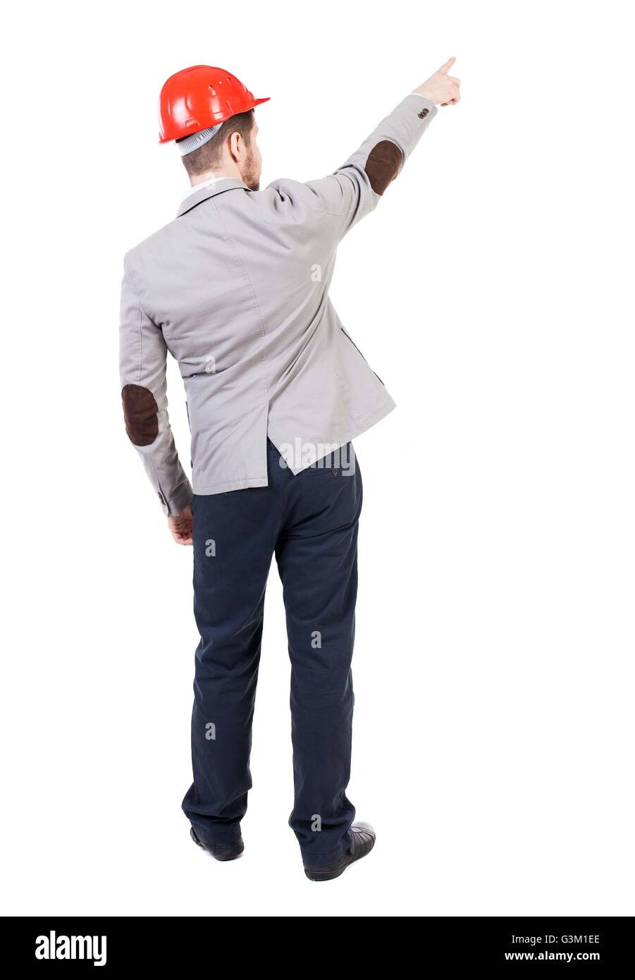 Back view of pointing young men in helmet. Young guy gesture. Rear view ...