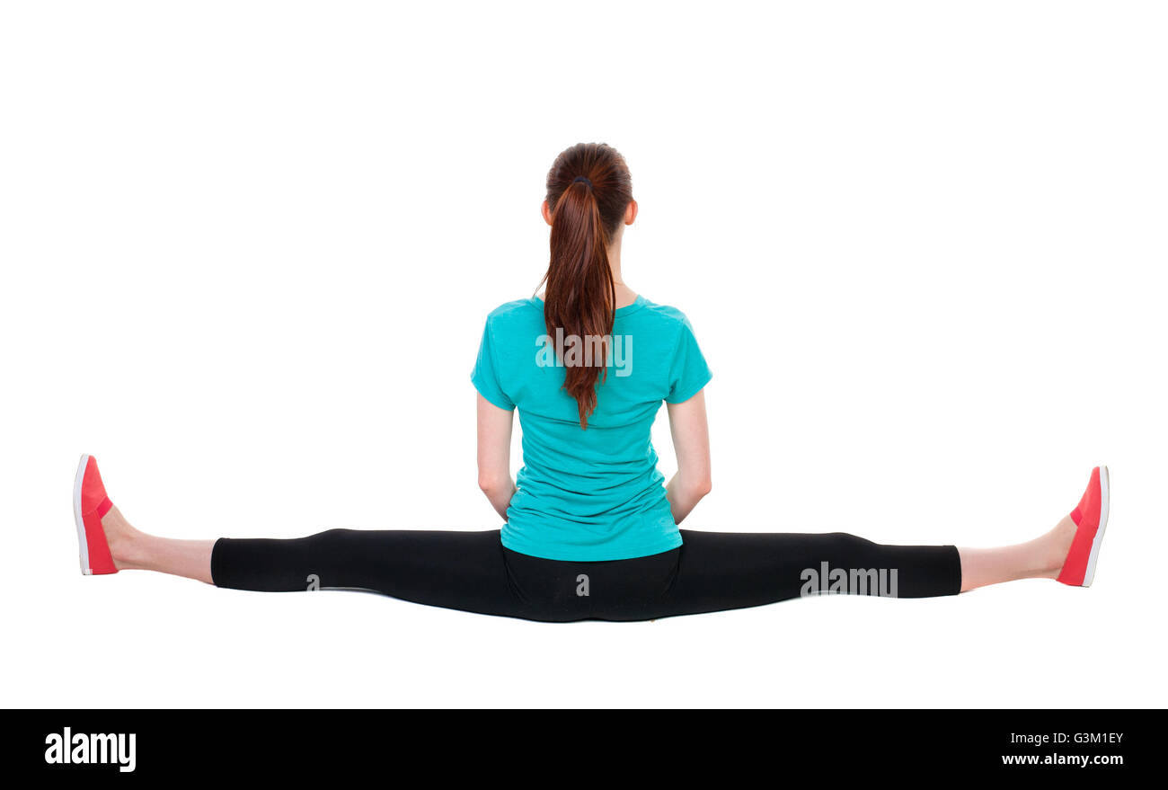 back view of standing young beautiful woman in sport dress involved in ...