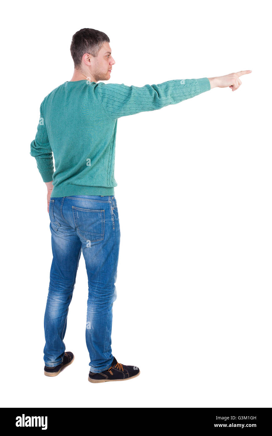 Back view of pointing young men in jeans. Young guy gesture. Rear view ...
