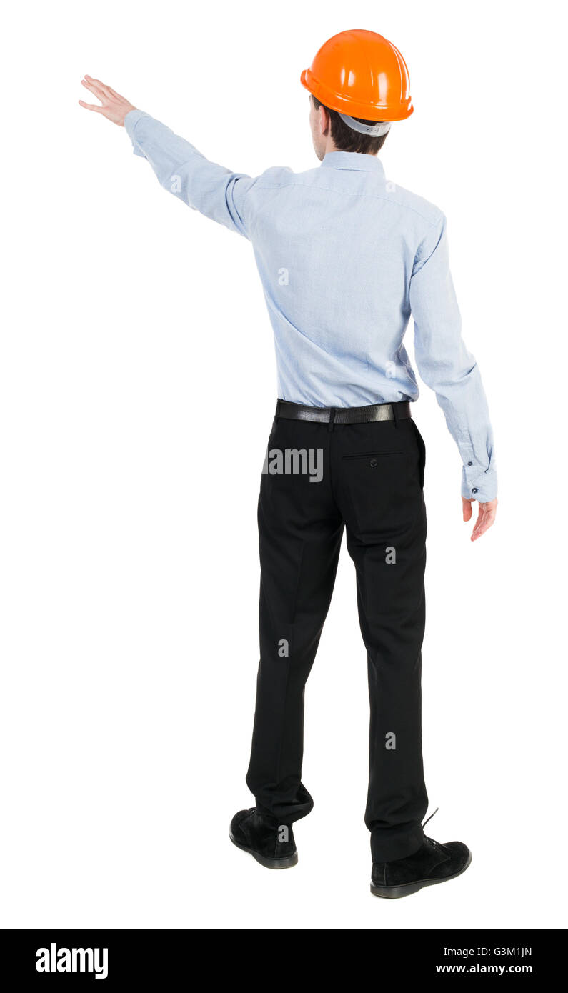Back view of pointing young men in shirt and helmet. Young guy gesture ...