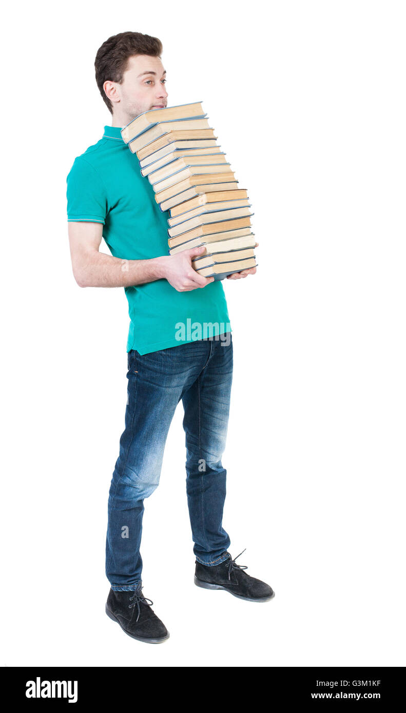 Back view of going handsome man carries a stack of books. walking young ...