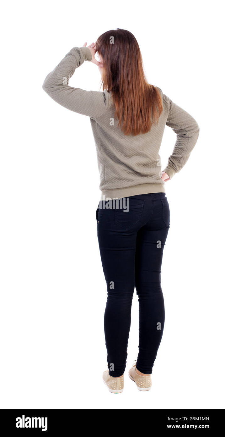 back view of standing young beautiful woman. girl watching. Rear view ...