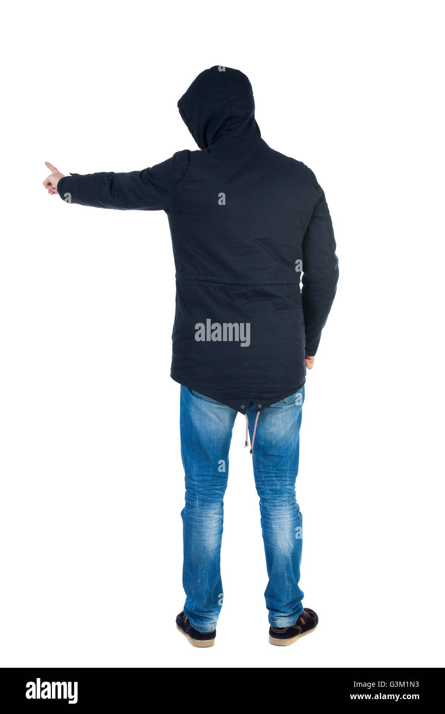Back view of pointing young men in parka. Young guy gesture. Rear view ...