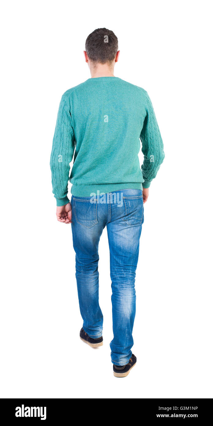 Back view of going handsome man in jeans and a shirt. walking young guy ...
