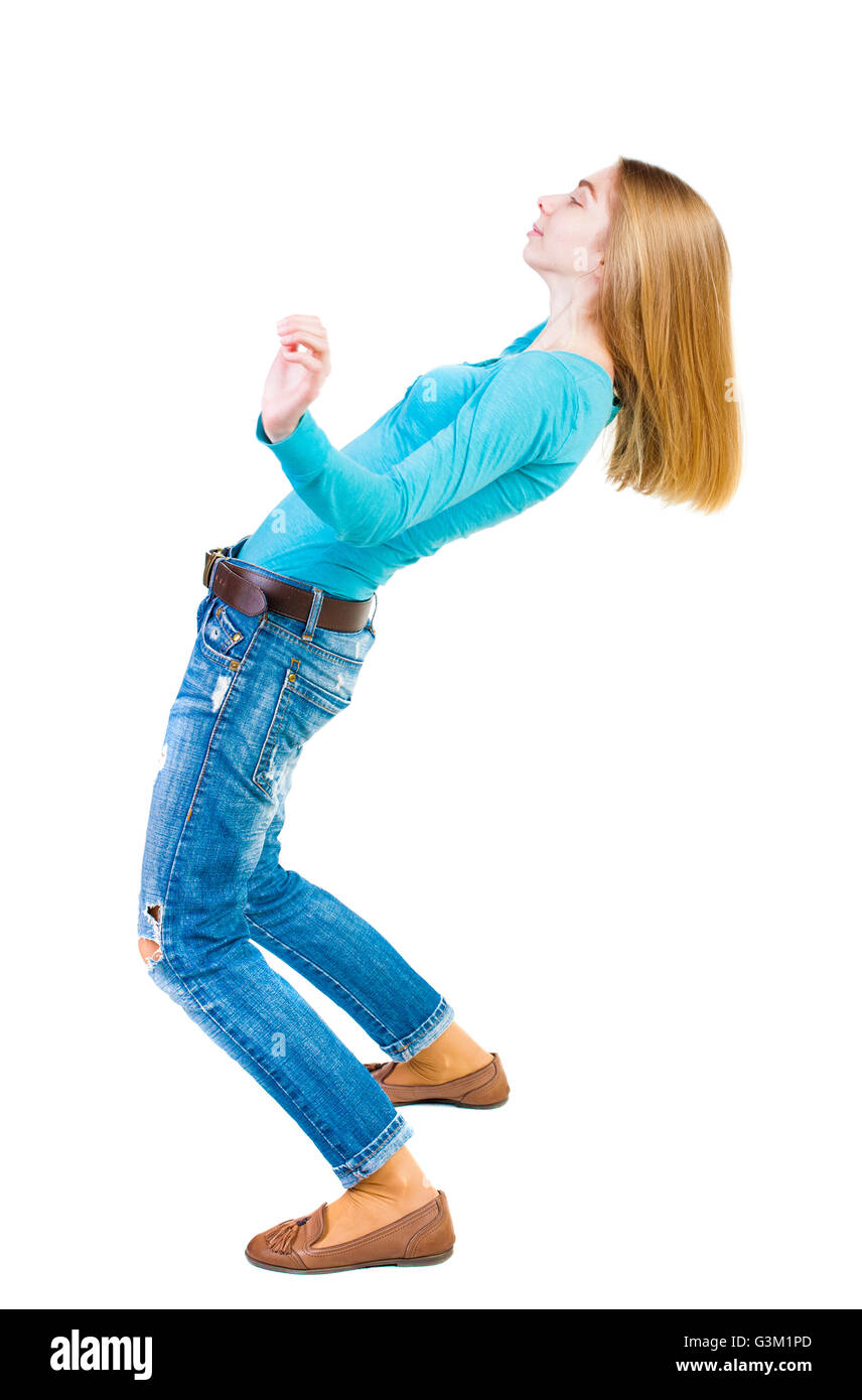 Balancing young woman. or dodge falling woman. Rear view people ...