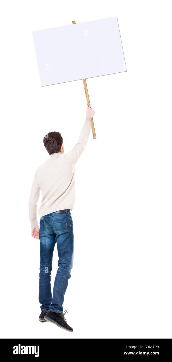 Back view man showing sign board. man holds information plate. Rear ...