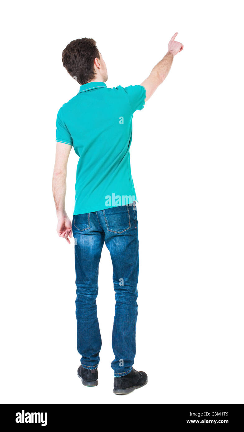 Back view of pointing young men in shirt and jeans. Young guy gesture ...