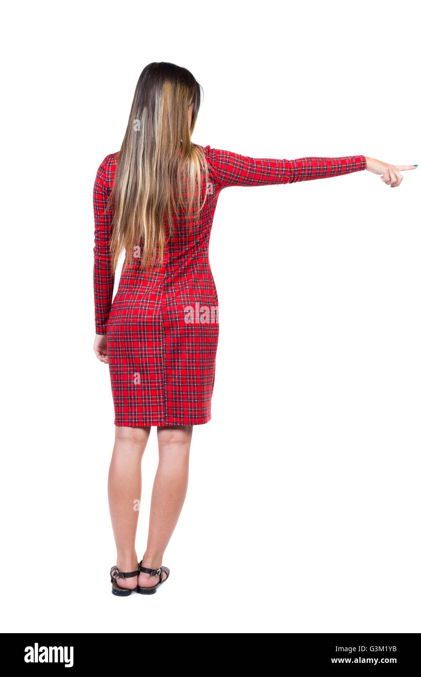 Back view of pointing woman. beautiful girl. Rear view people ...