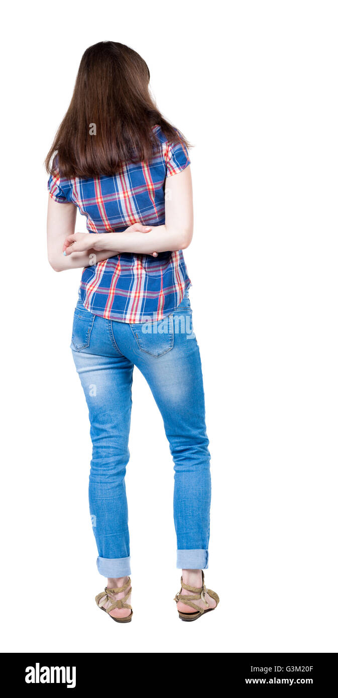 back view of standing young beautiful woman. girl watching. Rear view ...