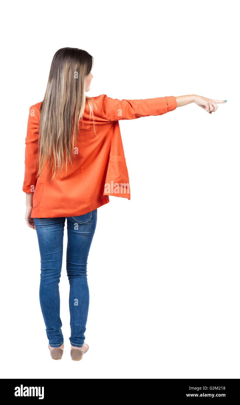Back view of pointing woman. beautiful girl. Rear view people ...