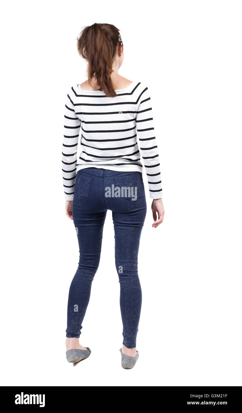 back view of standing young beautiful woman. girl watching. Rear view ...