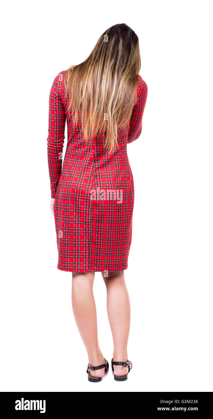 back view of standing young beautiful woman. girl watching. Rear view ...