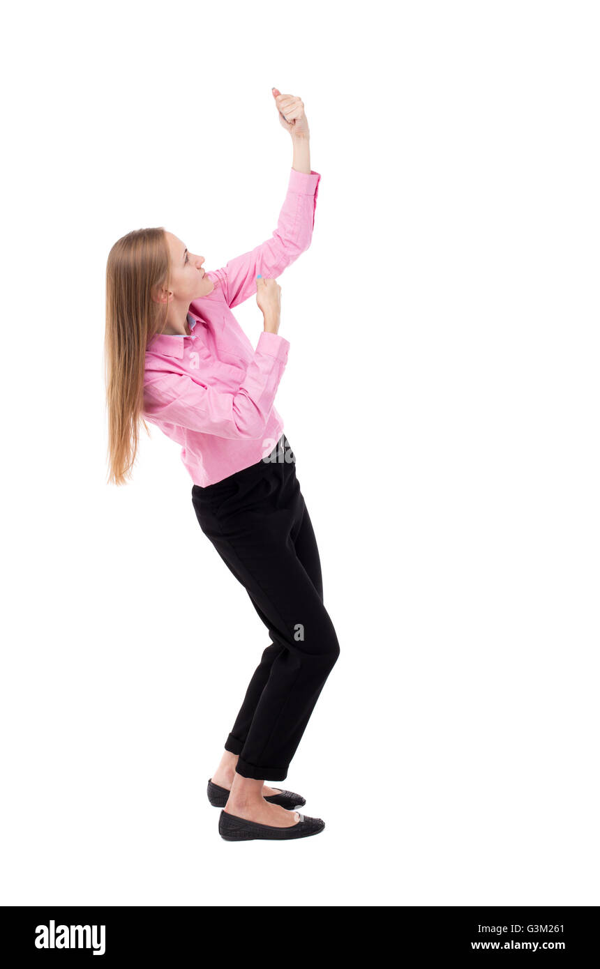 back view of standing business woman pulling a rope from the top or ...