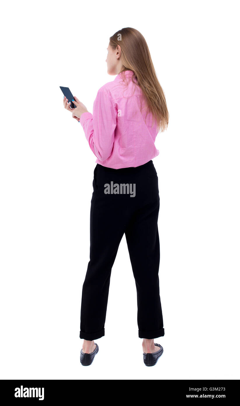 back view of standing young beautiful woman and using a mobile phone ...