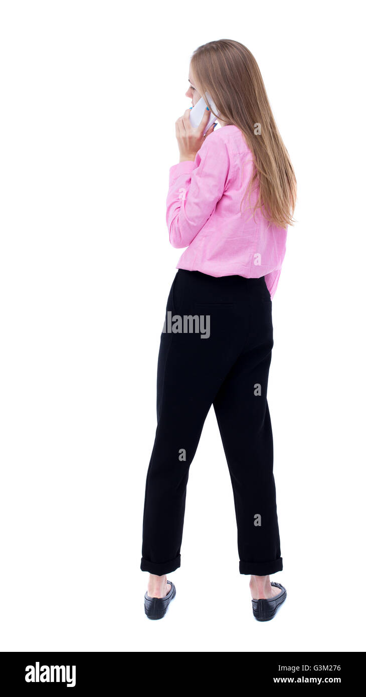 back view of a woman talking on the phone. backside view of person ...
