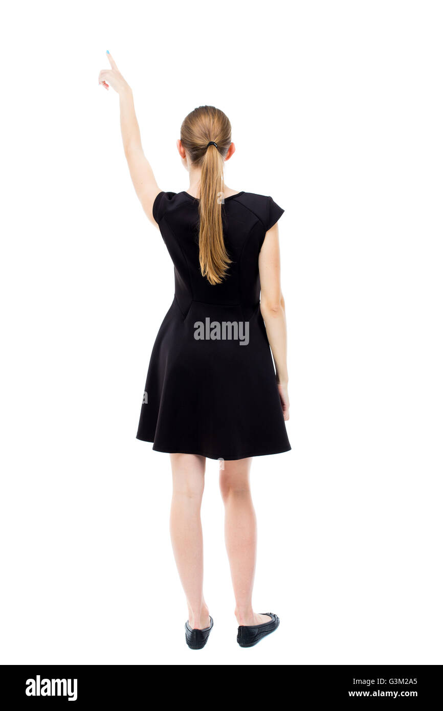 Back view of pointing woman. beautiful girl. Rear view people ...