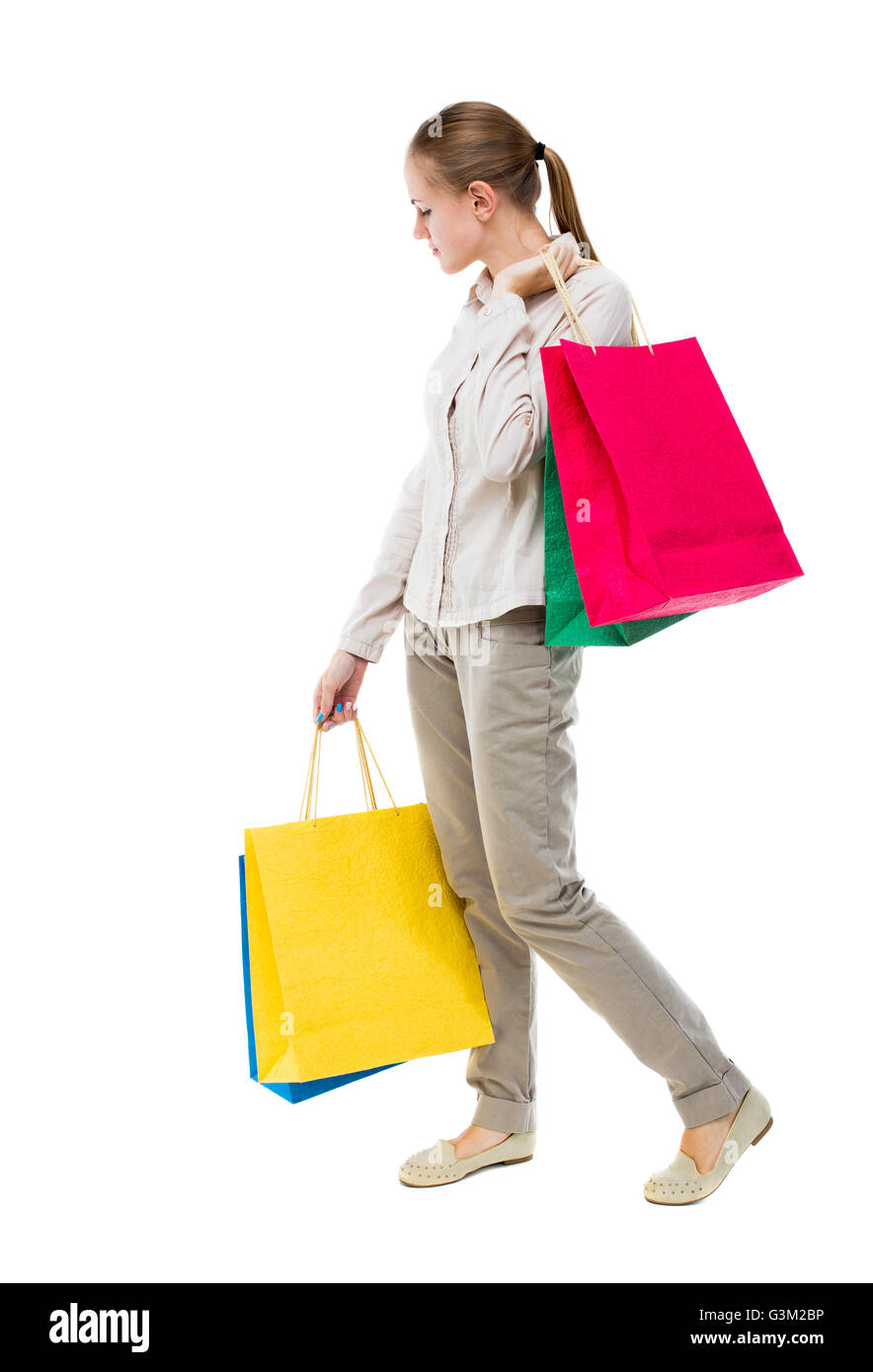 back view of woman with shopping bags . beautiful brunette girl in ...
