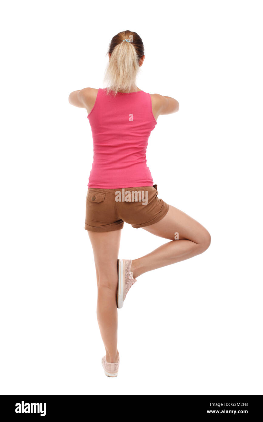 Back view of girl standing in front of a warm up exercise. Rear view ...