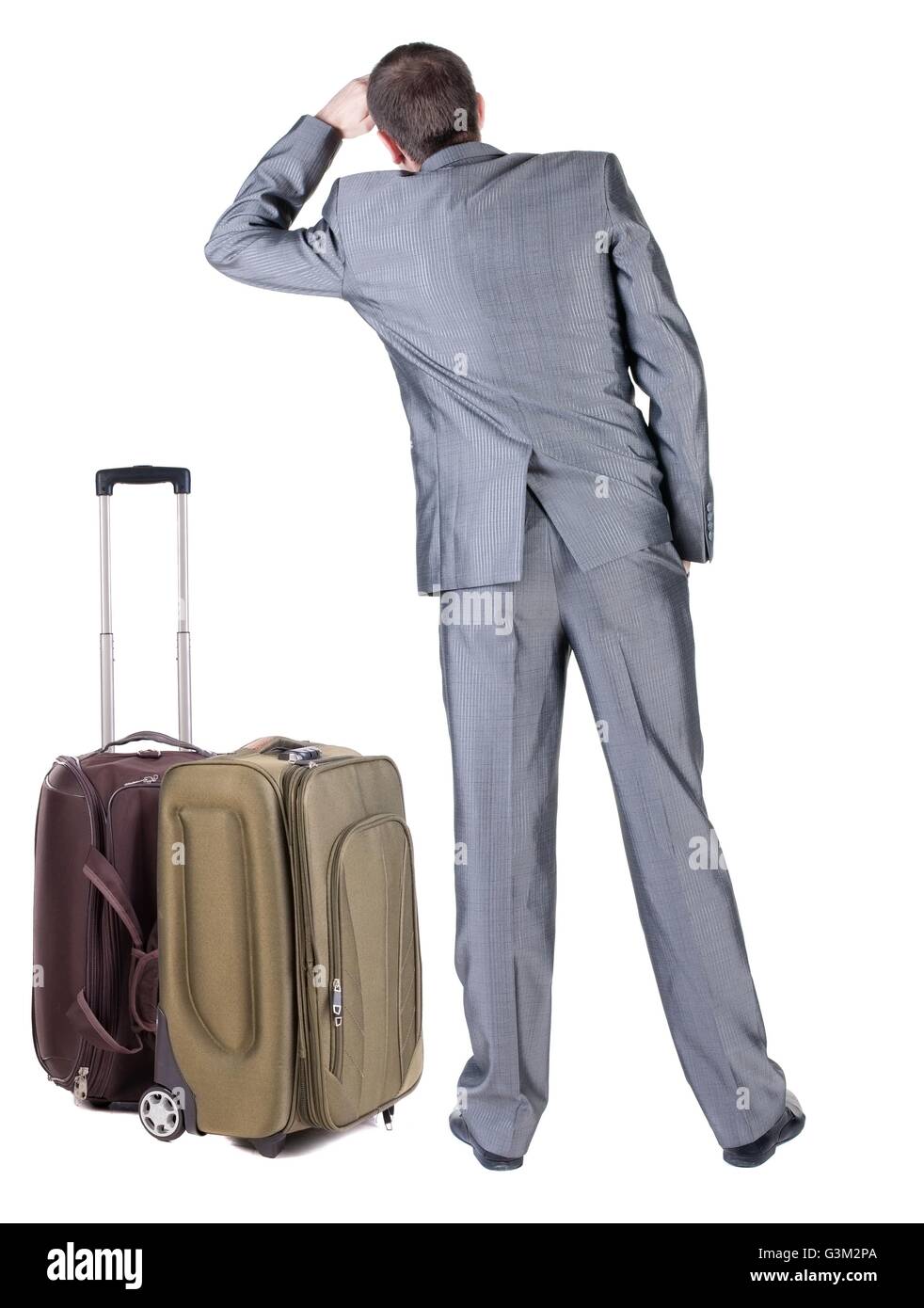 Back view of traveling busness man with suitcase looking up. Standing ...